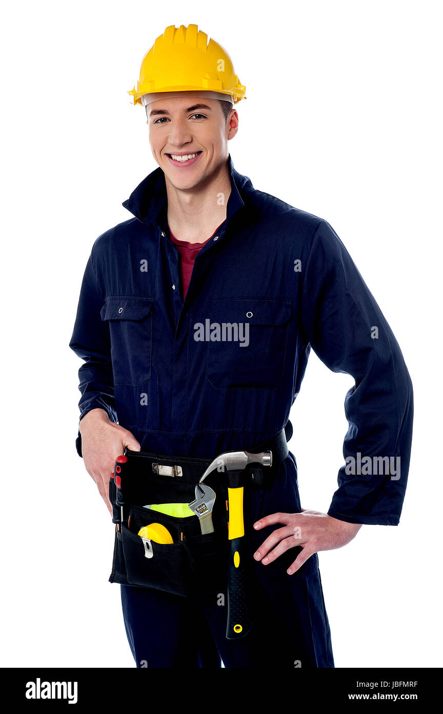 Young male worker with a tool belt, hand on hip Stock Photo - Alamy