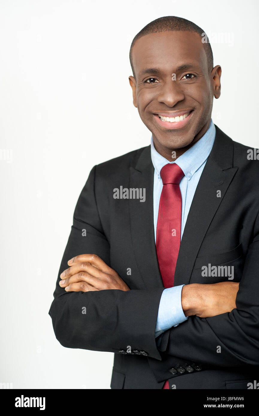Handsome african male manager with arms crossed Stock Photo - Alamy