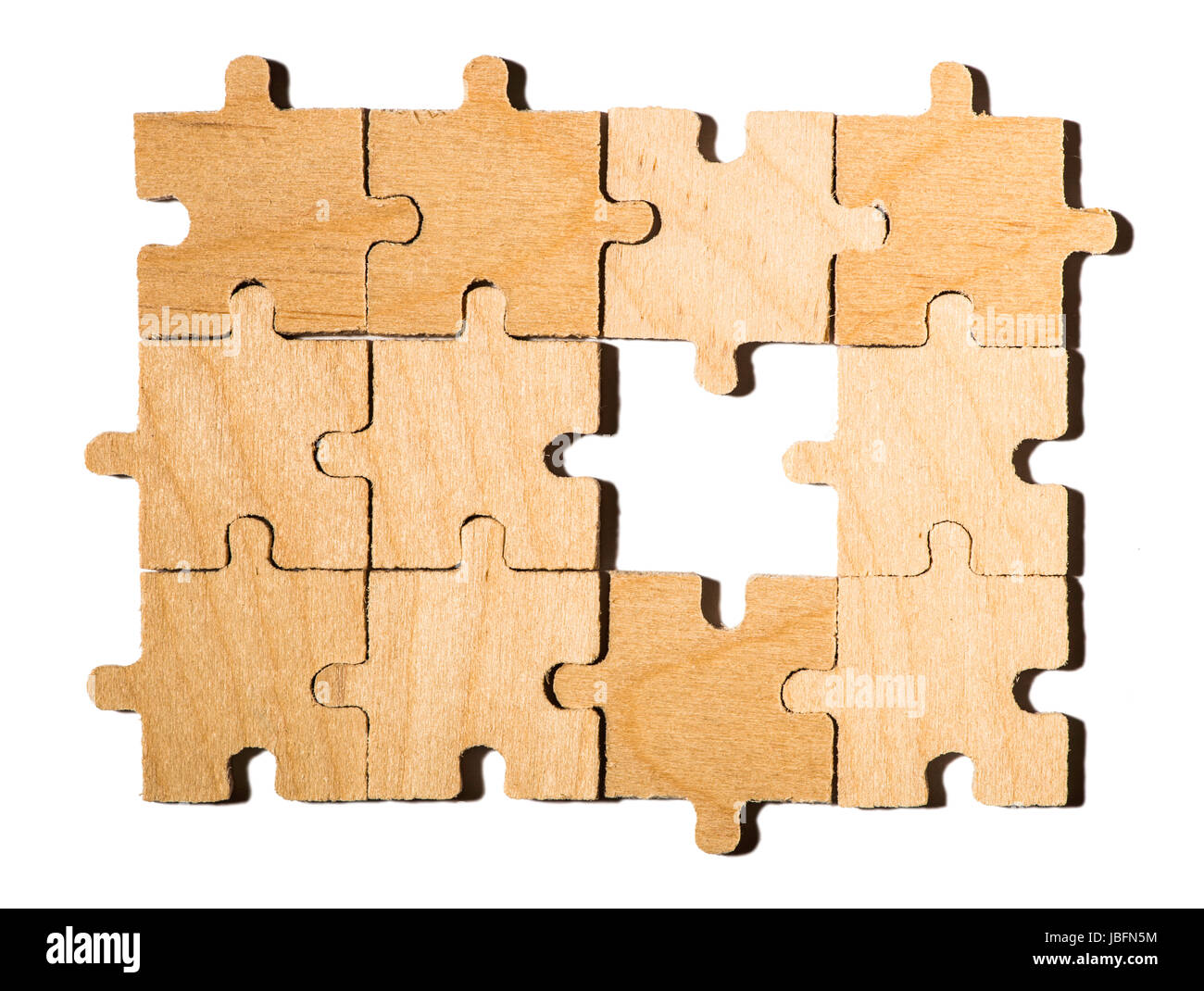 Wooden puzzle on white background. White isolated Stock Photo - Alamy