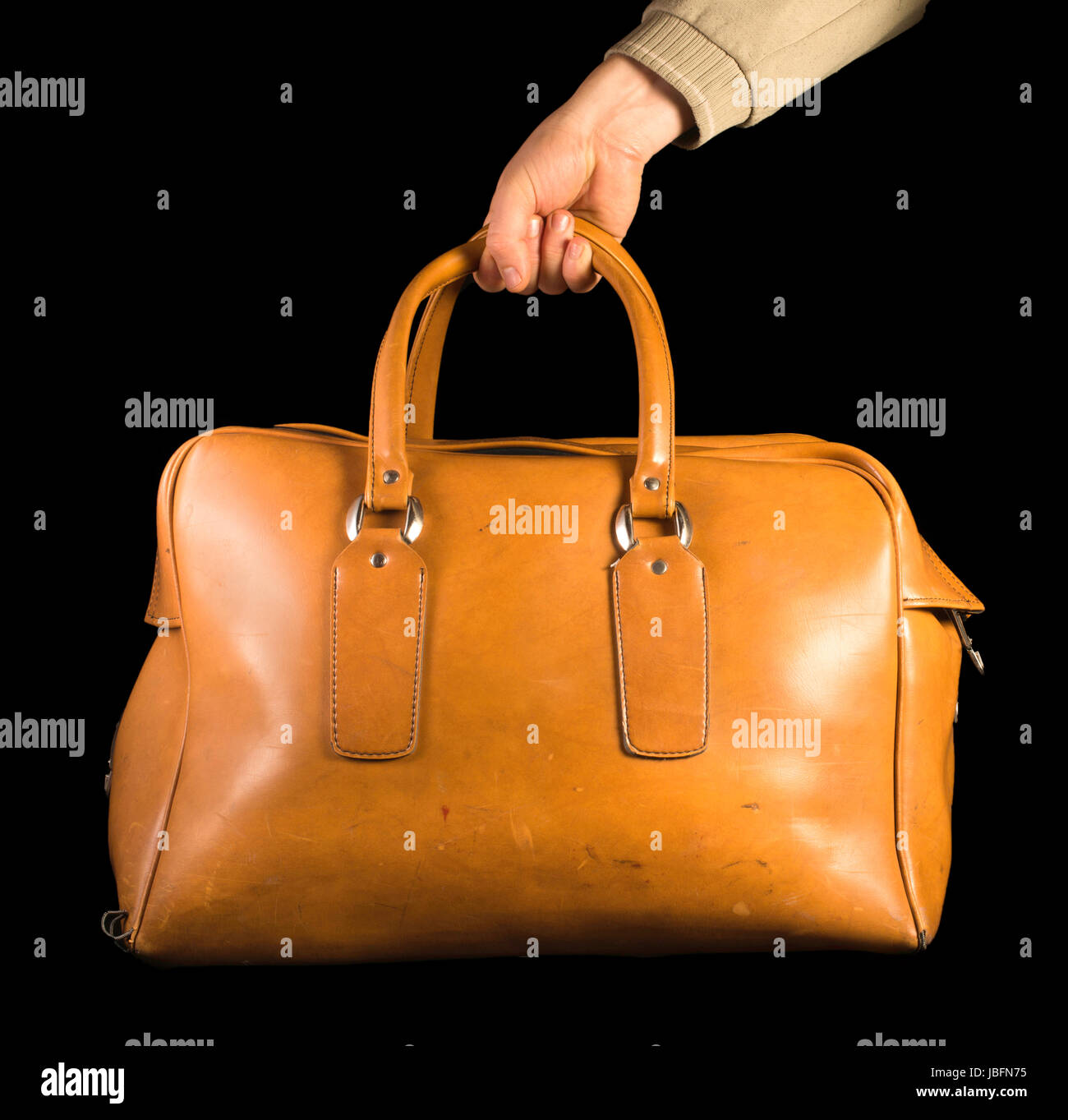 Old vintage luggage brown bag. Black isolated Stock Photo - Alamy