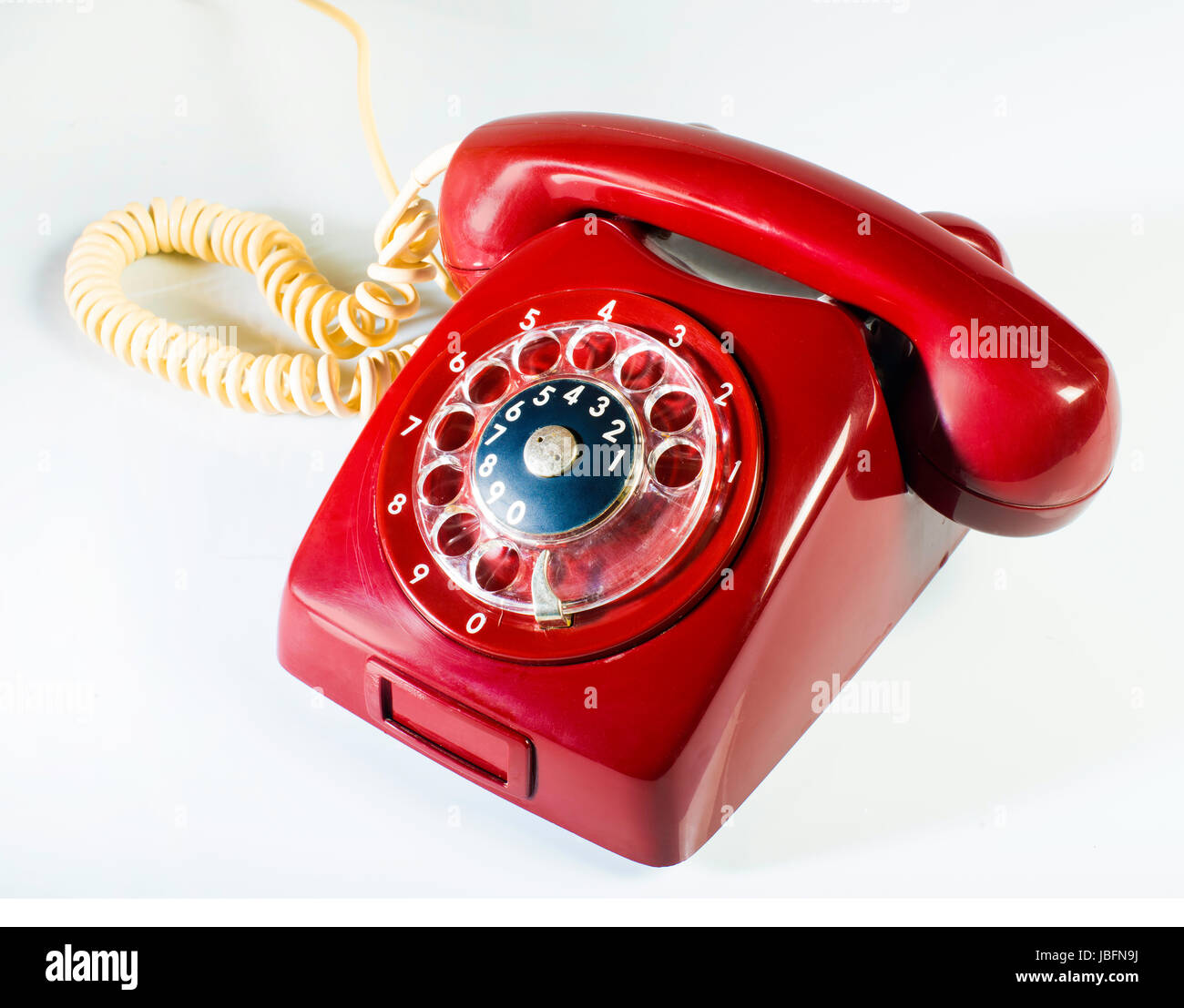 Vintage red phone on white background. White cable Stock Photo - Alamy