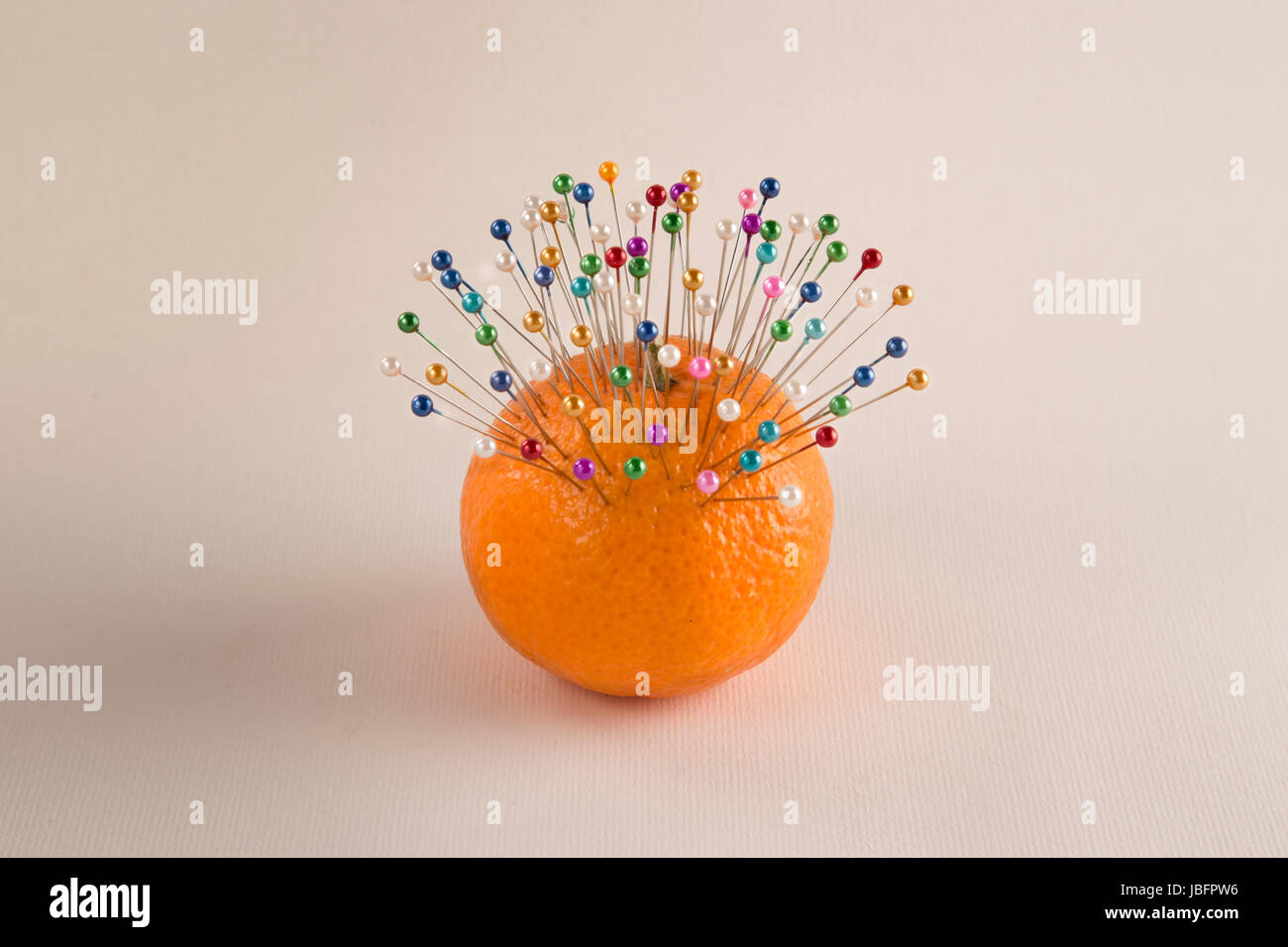 Mandarin and pins Stock Photo - Alamy