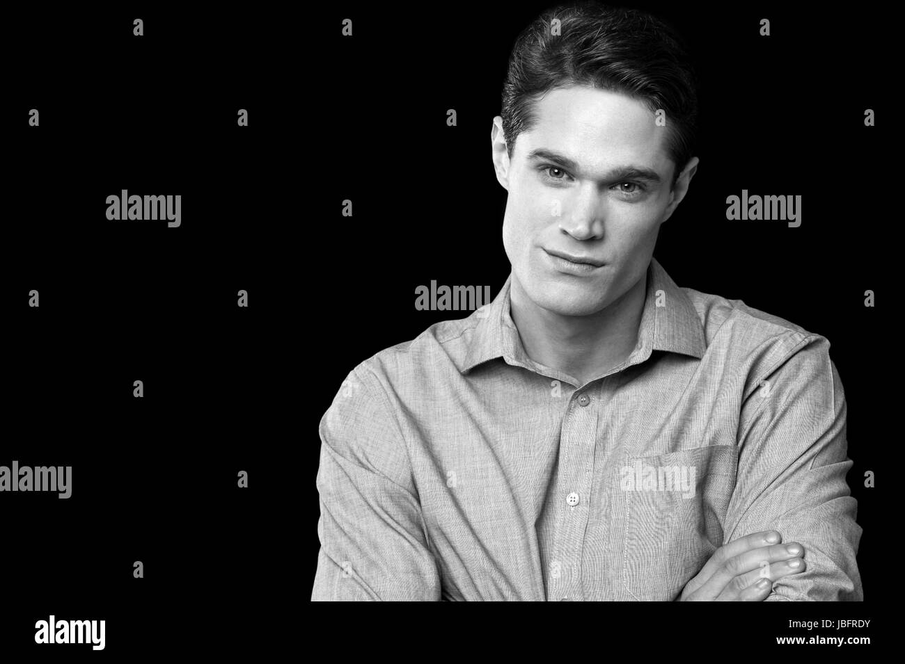 Handsome man posing with confidence Stock Photo - Alamy