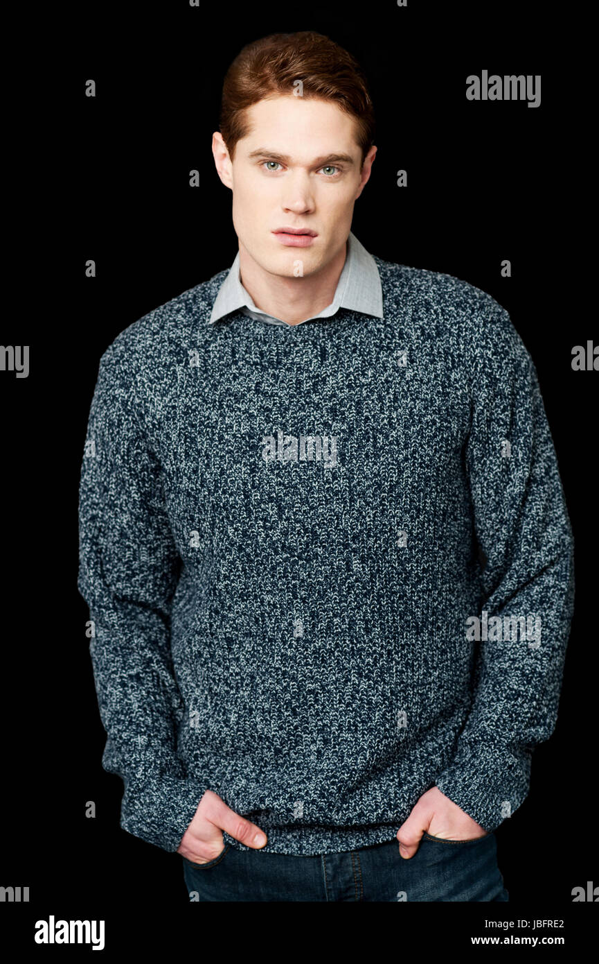 Handsome cool dude posing in style, black background Stock Photo - Alamy