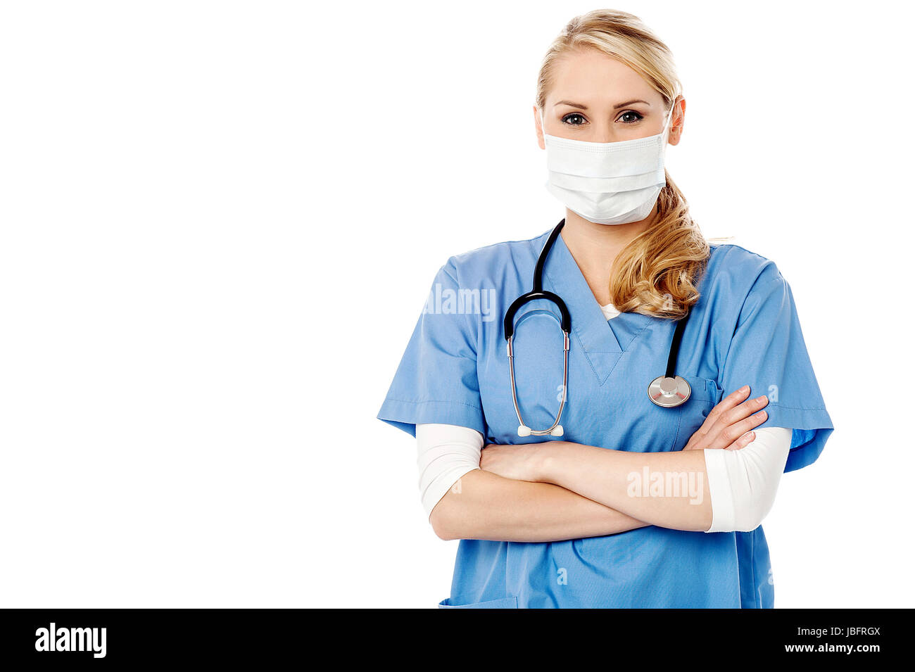 Physician covering her face with surgical mask Stock Photo - Alamy