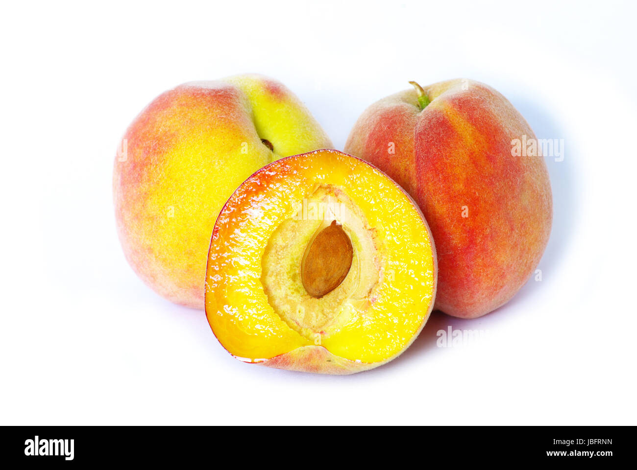 three peaches isolated on white Stock Photo - Alamy
