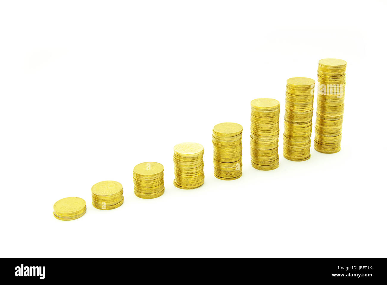 three towers of coins isolated on a whiteness Stock Photo - Alamy
