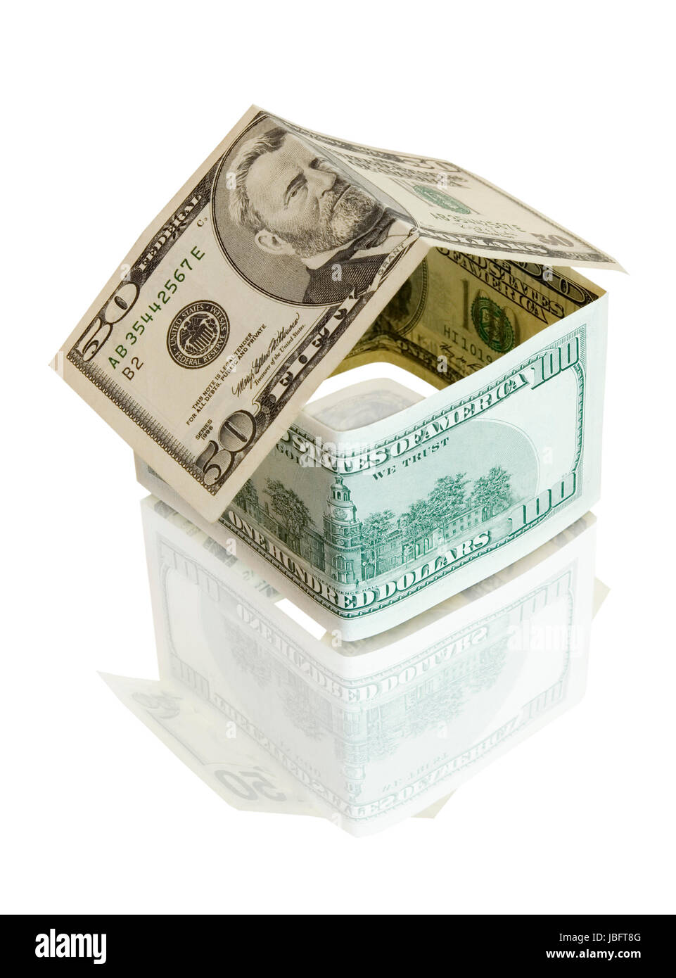 Money house on white background Stock Photo - Alamy