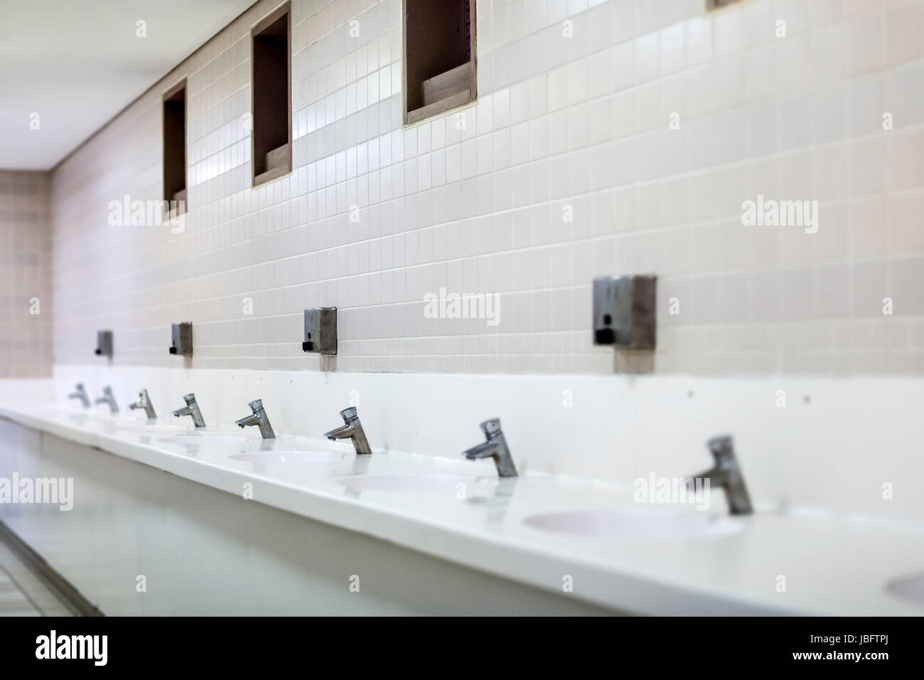 Picture of a public bathroom with sinks Stock Photo - Alamy
