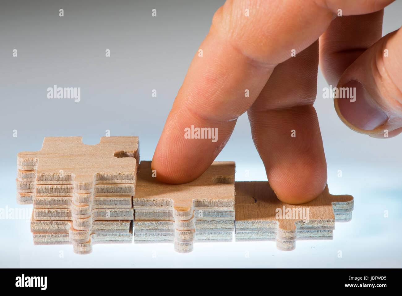Steps made of wooden puzzle partes. Backlight Stock Photo - Alamy