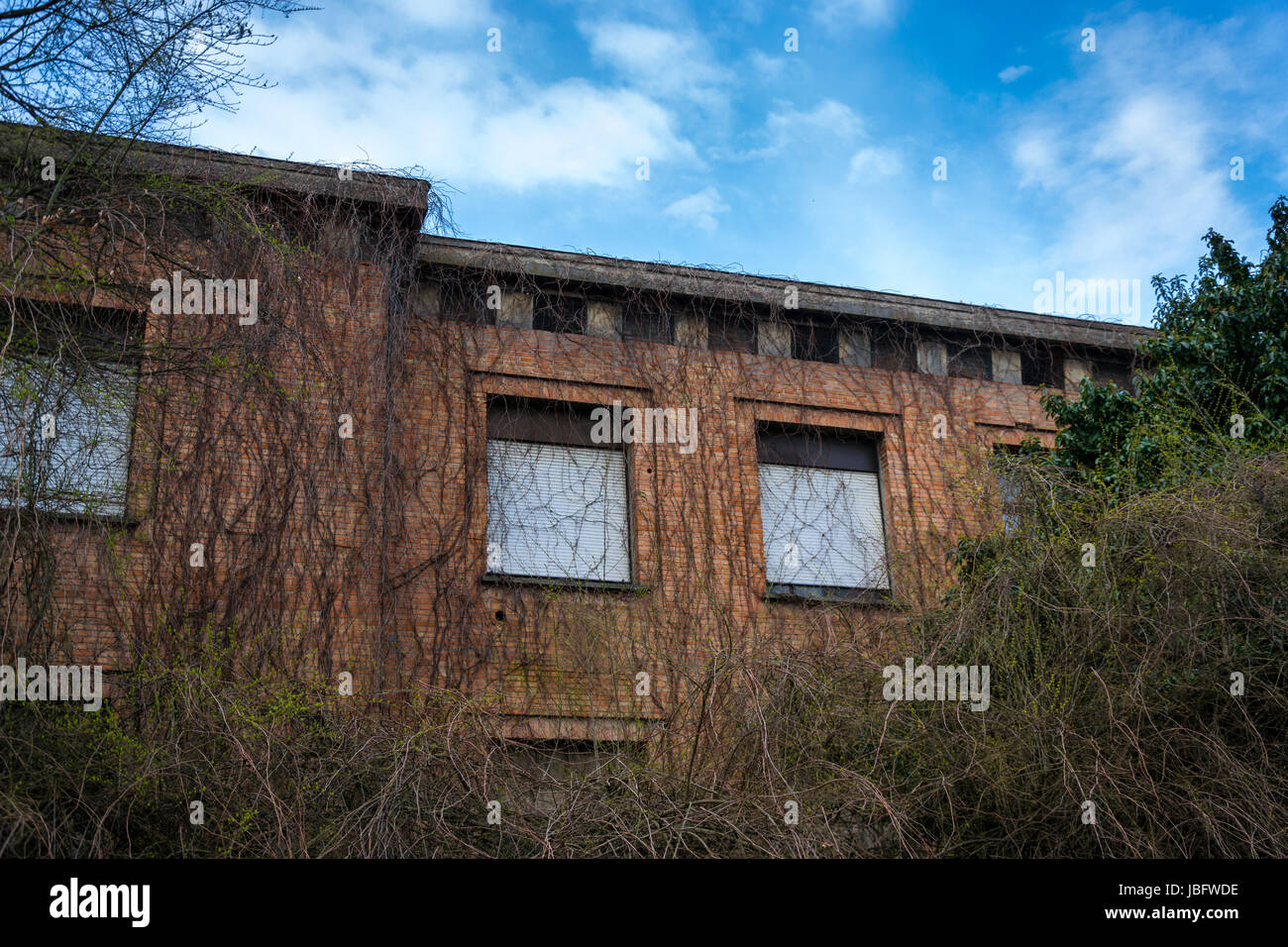 Old industrial factory abandoned in Italy Stock Photo - Alamy