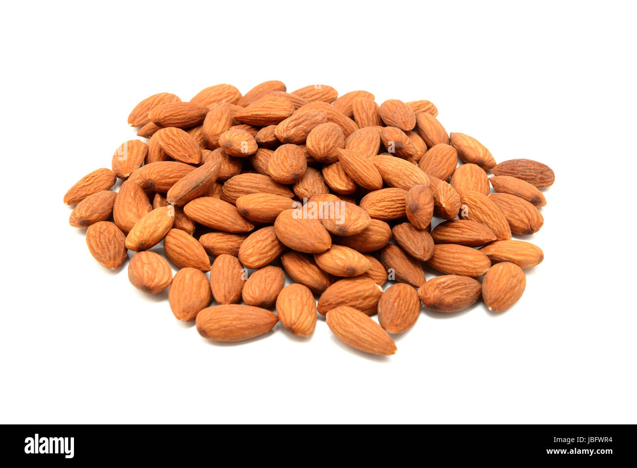 Whole unblanched almonds, isolated on a white background Stock Photo ...