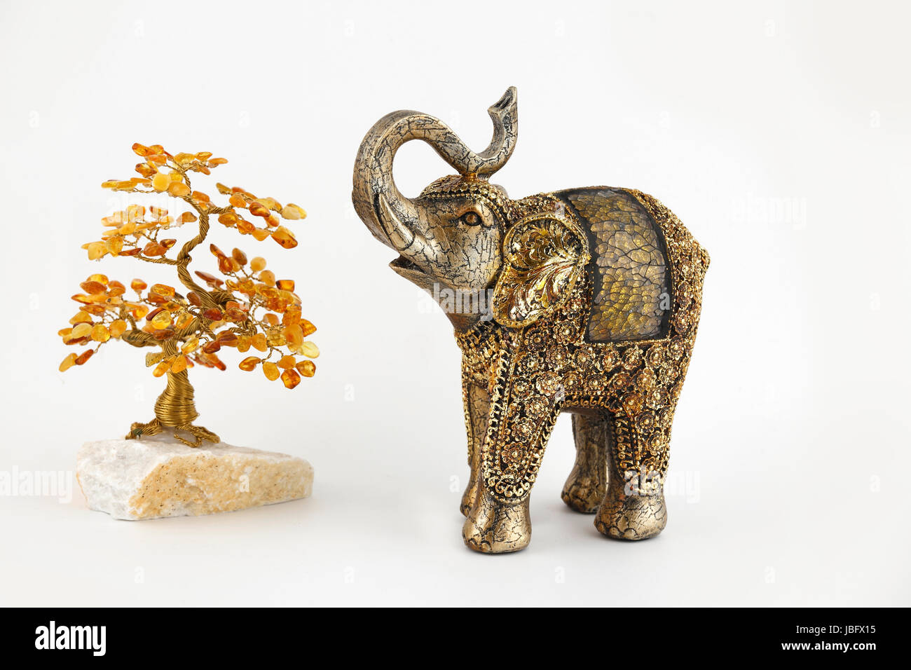 Elephant and amber tree Stock Photo - Alamy