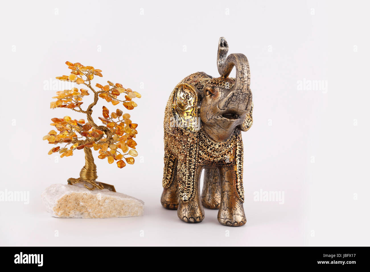 Elephant and amber tree Stock Photo - Alamy