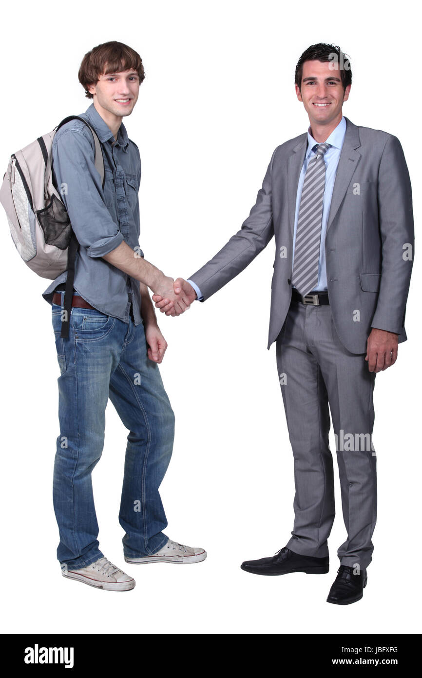Student shaking teacher's hand Stock Photo - Alamy