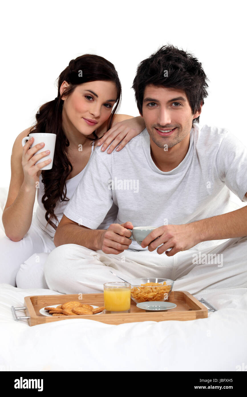 Couple having coffee biscuits hi-res stock photography and images - Alamy