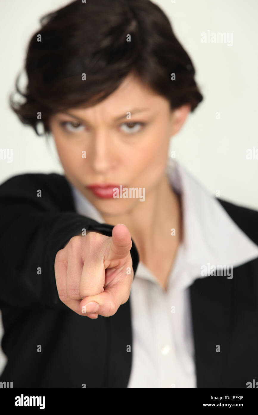 Strong businesswoman pointing at the camera Stock Photo - Alamy