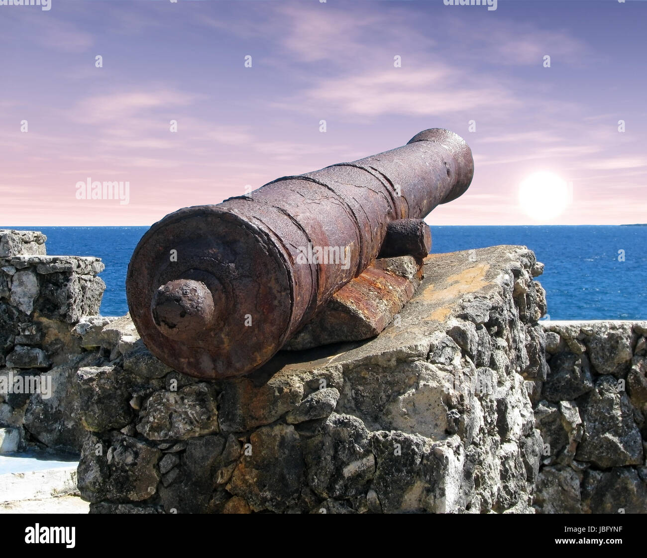 Colonial cannon in the ancient fortress on the caribbean coast at dawn ...