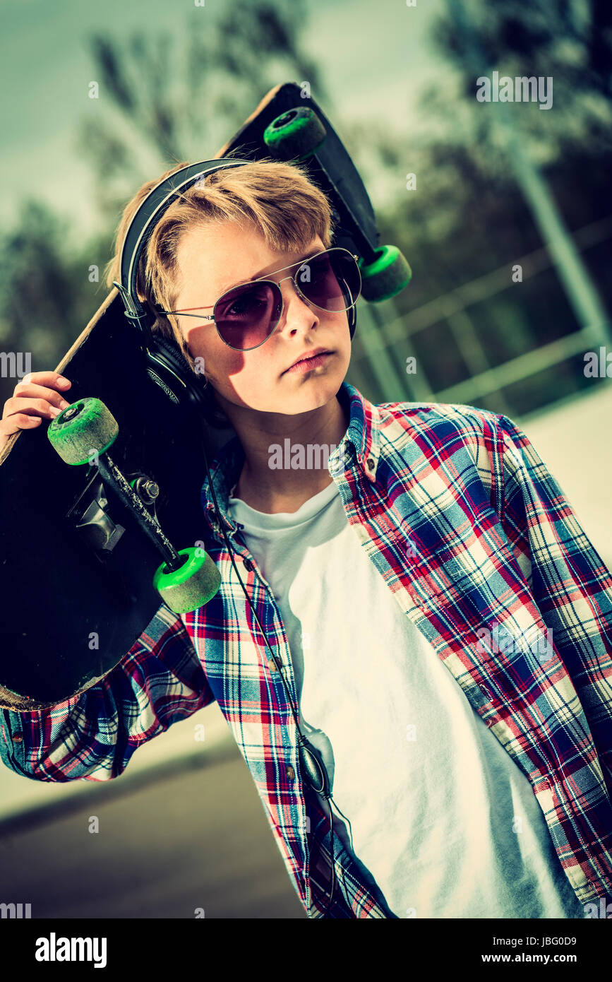 cool looking skater boy, with sunglasses and headphone vintage effect ...