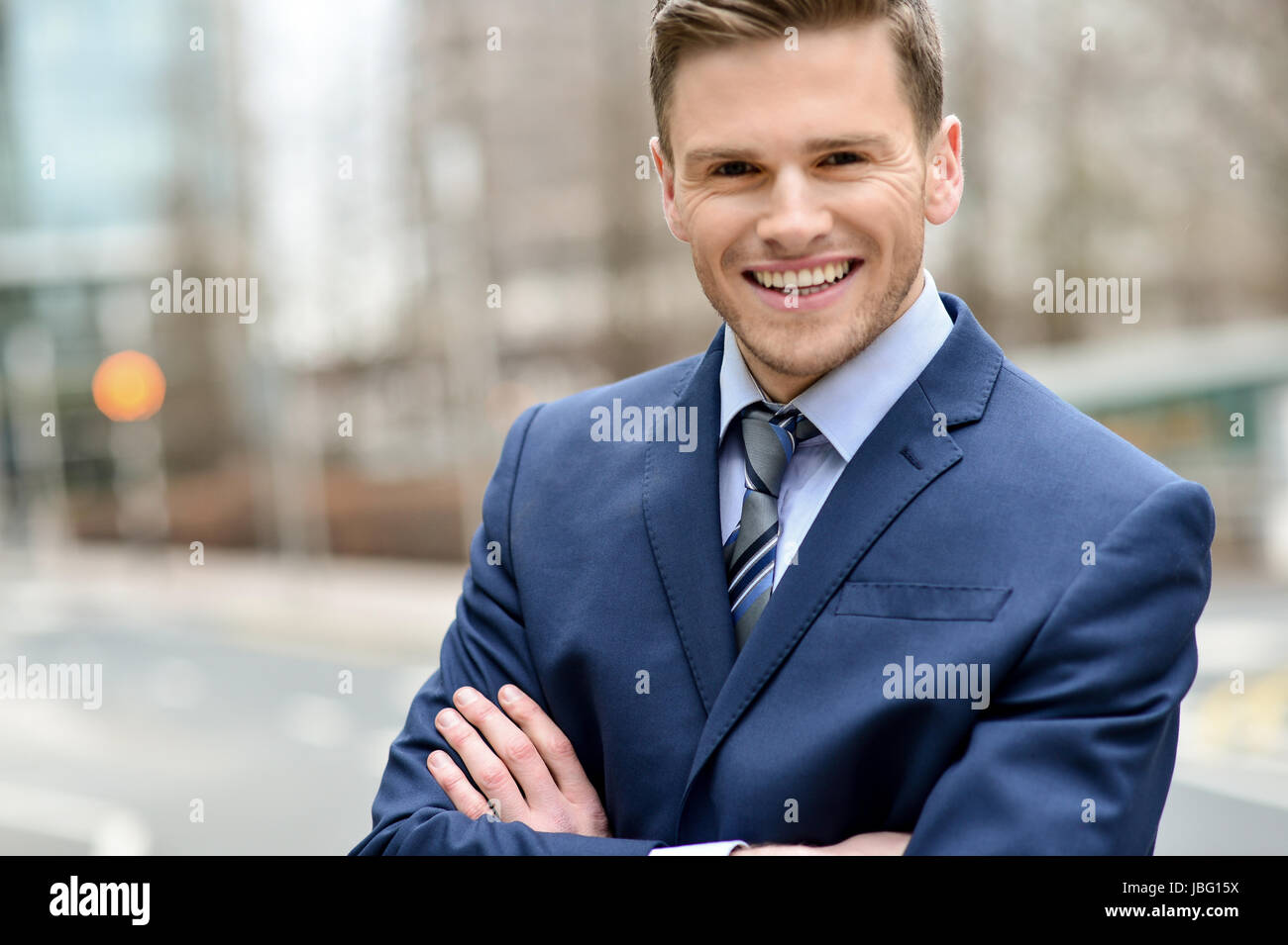 Handsome corporate guy posing confidently at outdoors Stock Photo - Alamy
