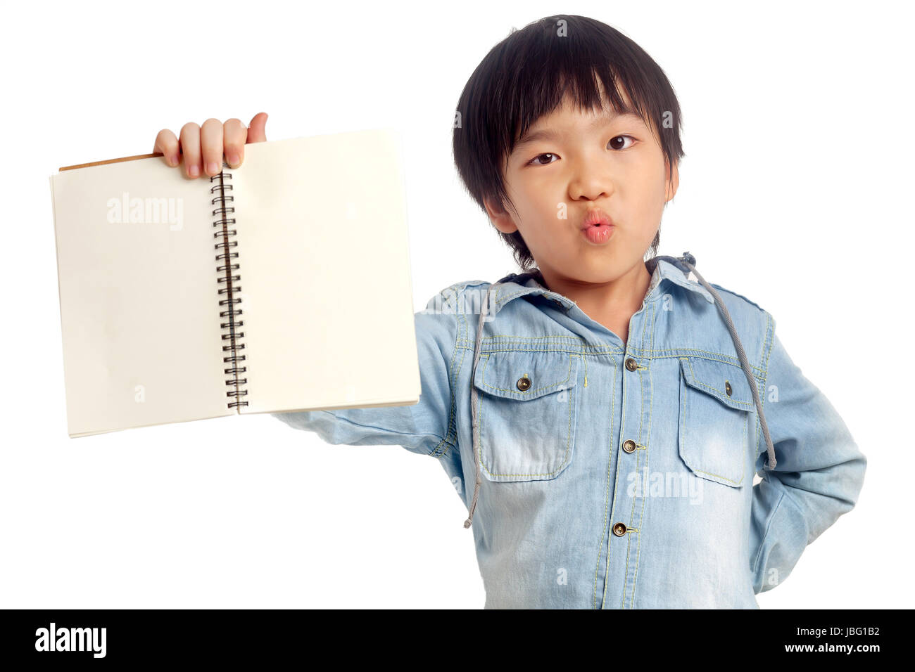Happy boy with hand holding notebook on white background Stock Photo ...