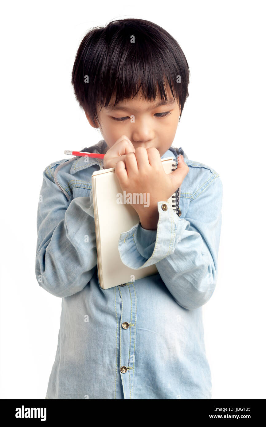 Asian boy writing on notebook isolated on white background Stock Photo ...
