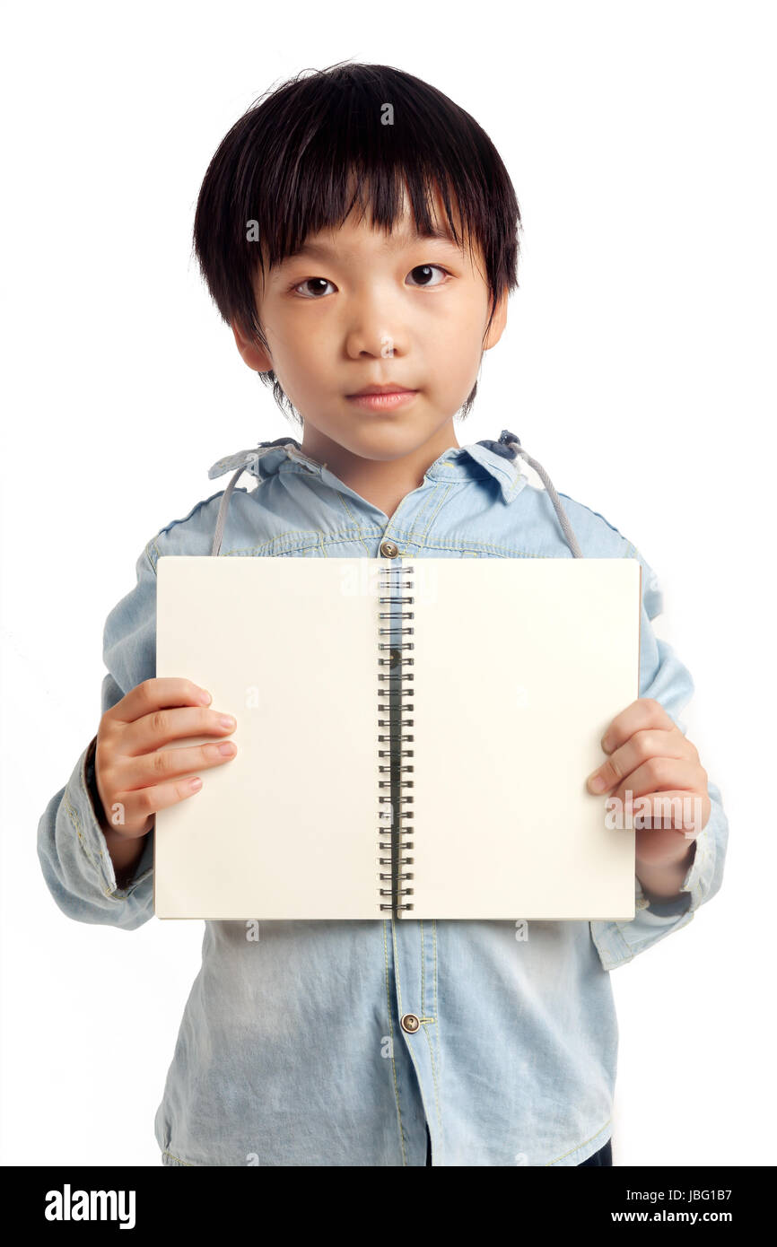 Asian boy holding open notebook isolated on white background Stock ...