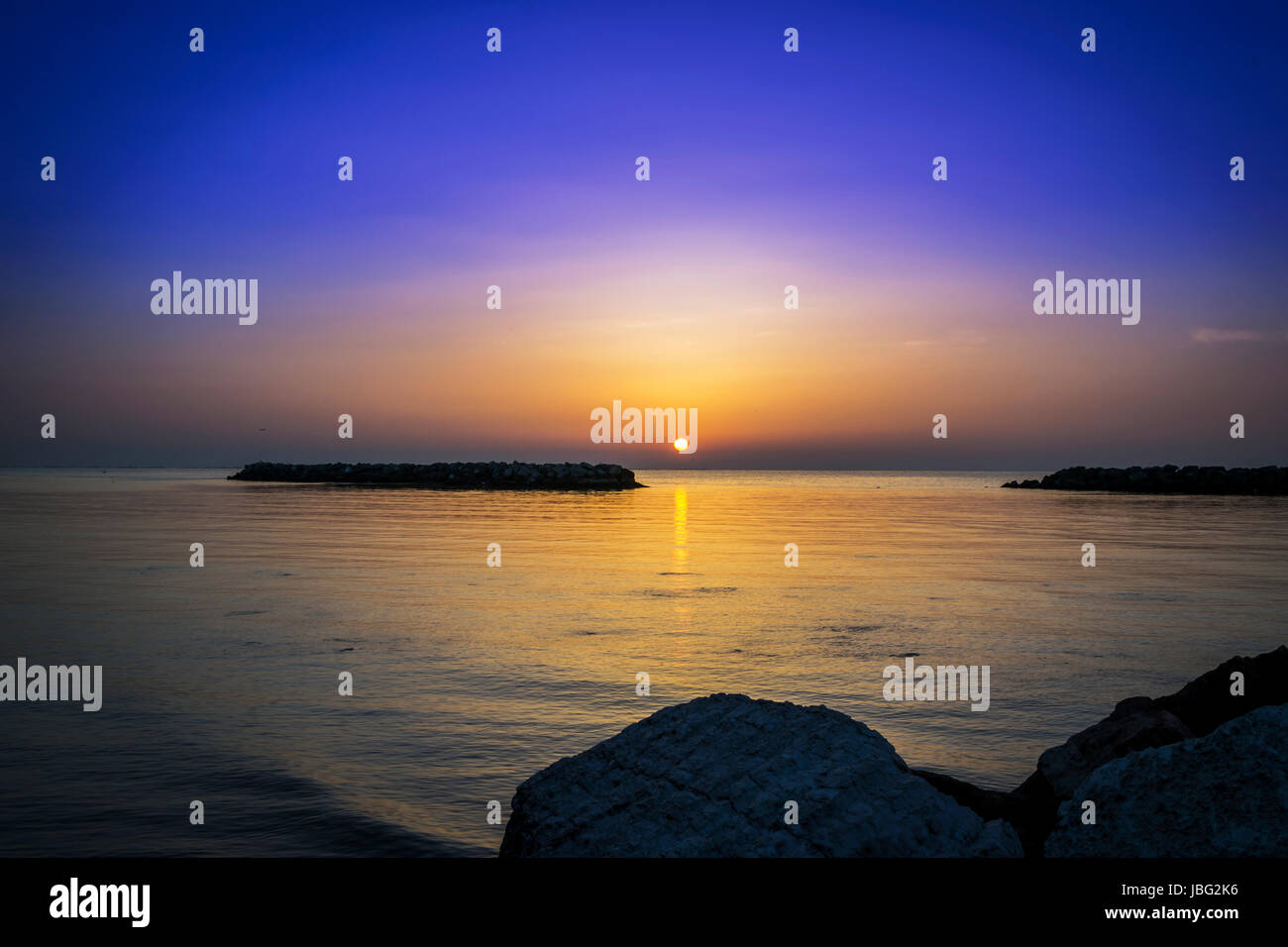 Beautiful sunrise by the sea in an Italian beach Stock Photo - Alamy