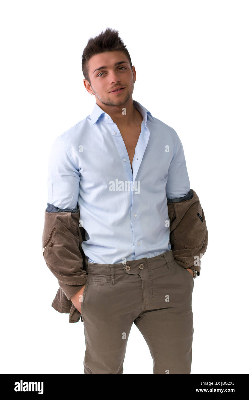 Handsome young man portrait, standing with jacket pulled down from ...