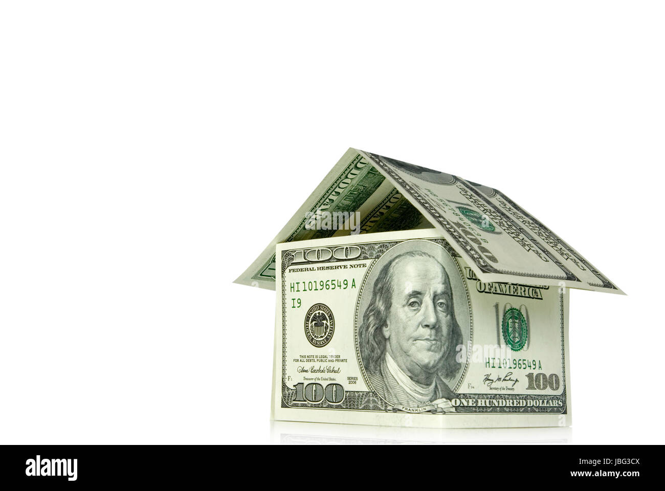 Money house on white background Stock Photo - Alamy