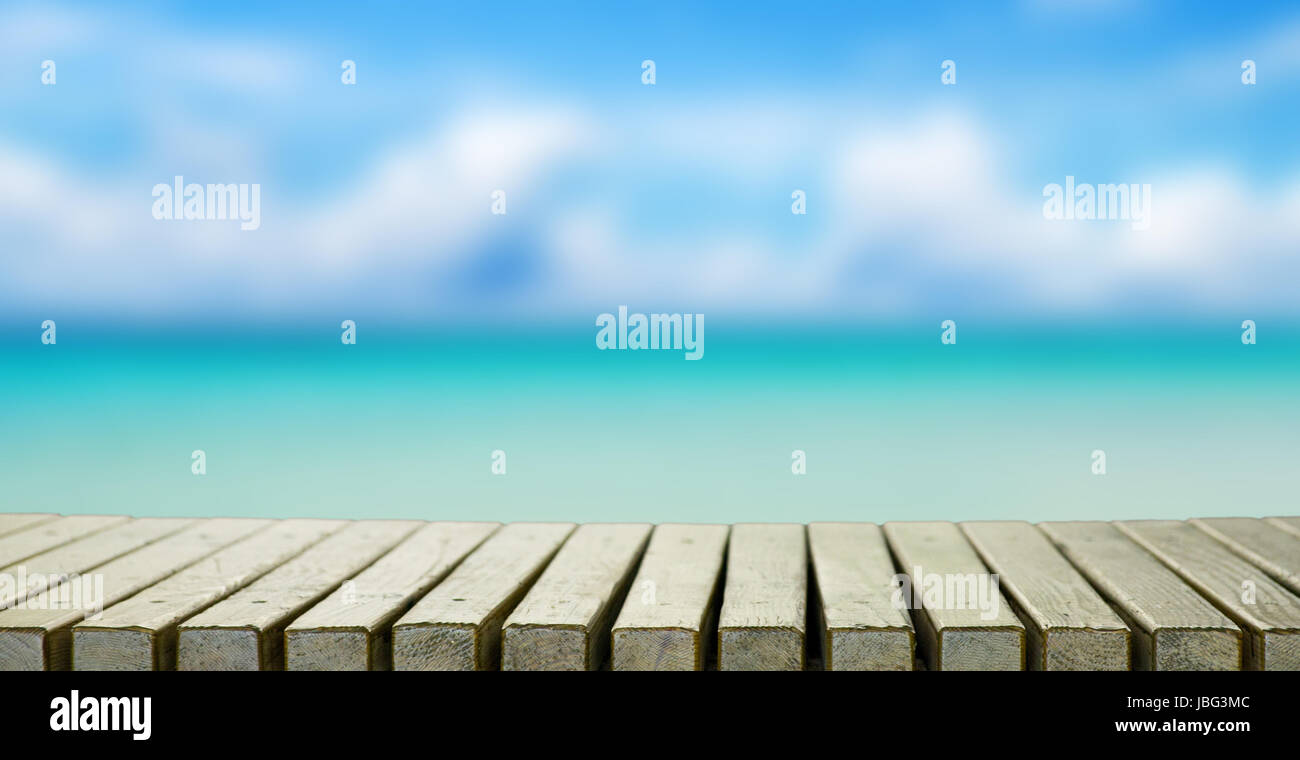 wooden table on the beach Stock Photo - Alamy