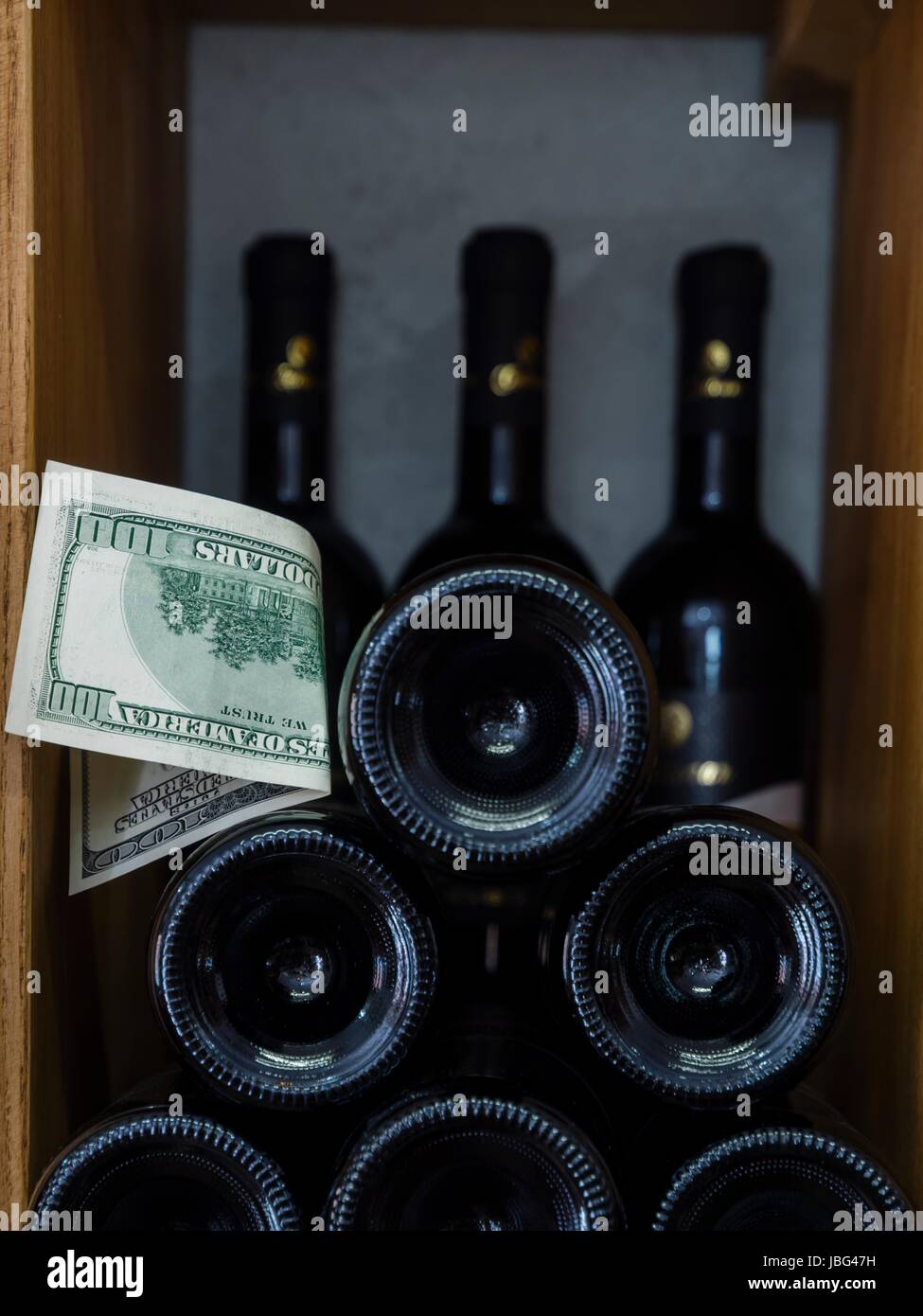 Wine cellar and dollars money Stock Photo - Alamy