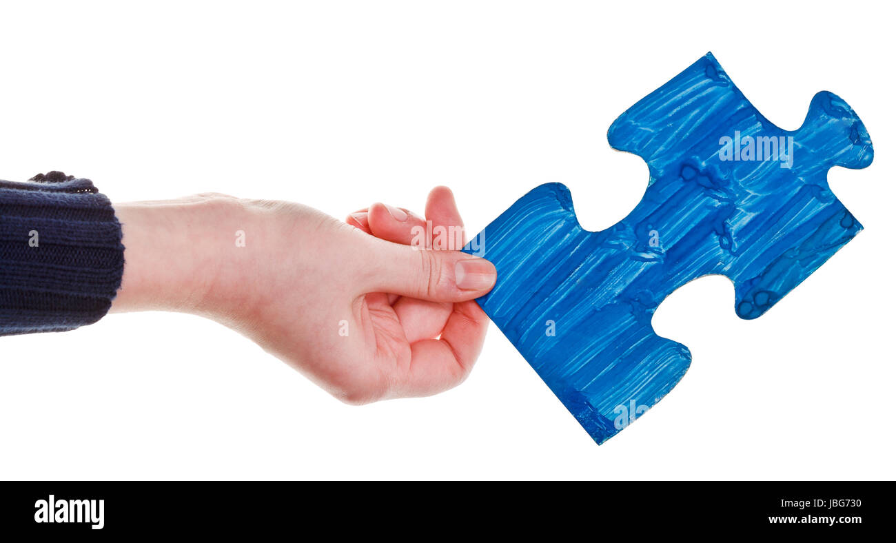 female hand with painted blue puzzle piece isolated on white background ...