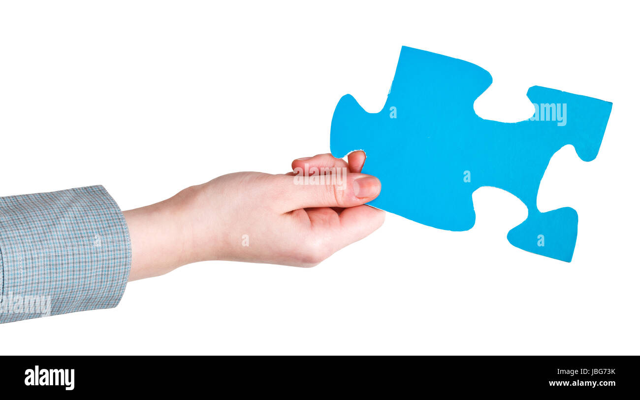 female hand holding big blue paper puzzle piece isolated on white ...
