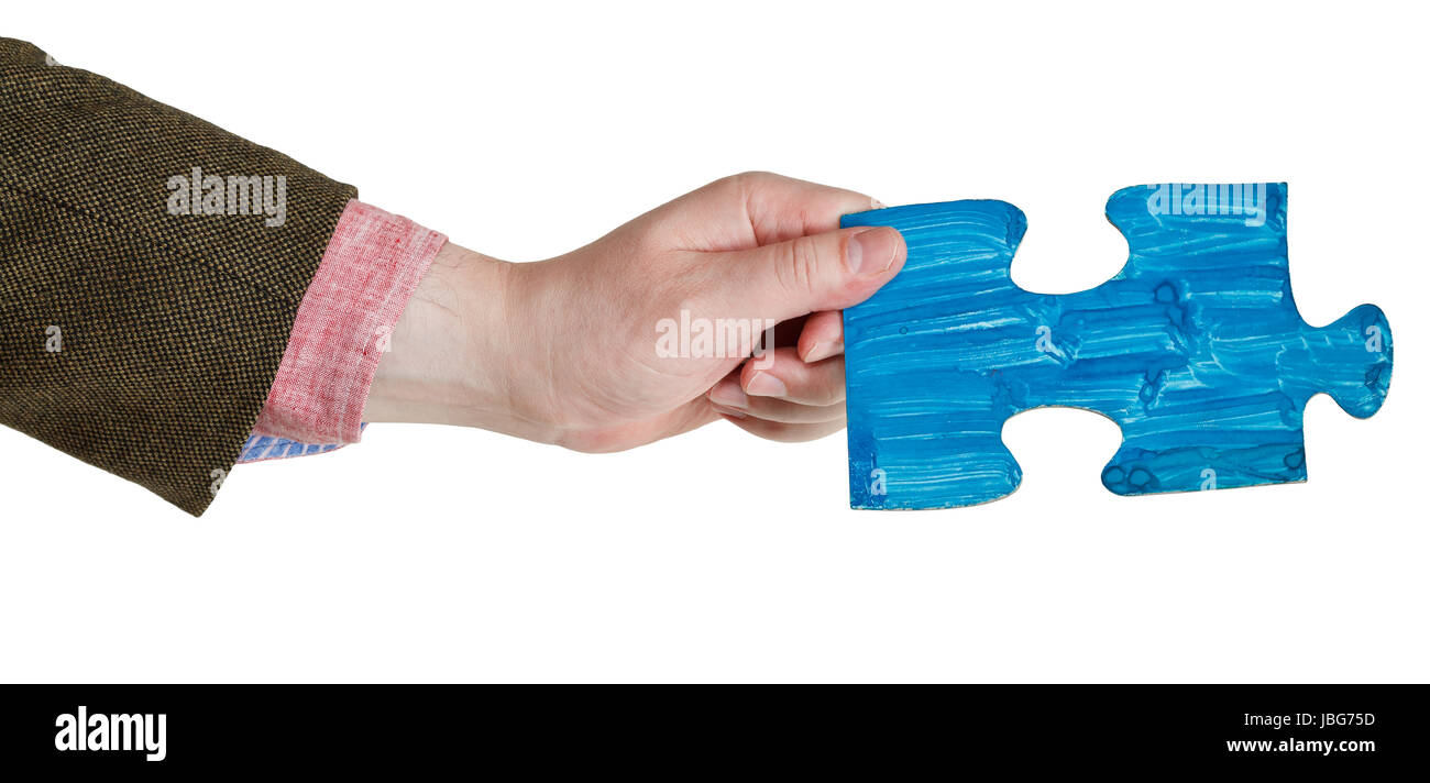 male hand with painted blue puzzle piece isolated on white background ...