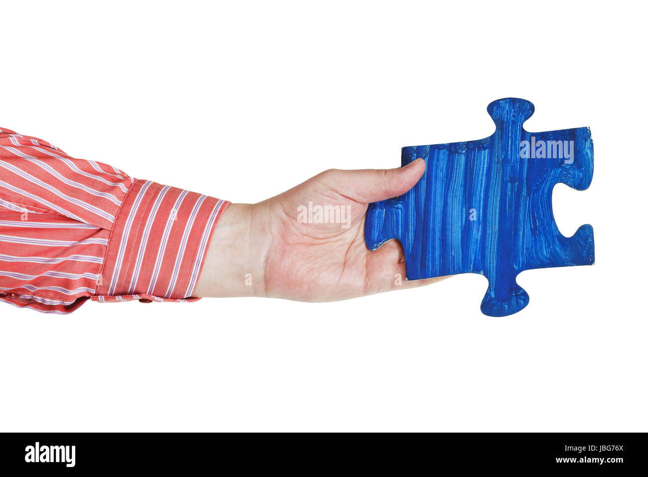 male hand with painted blue puzzle piece isolated on white background ...
