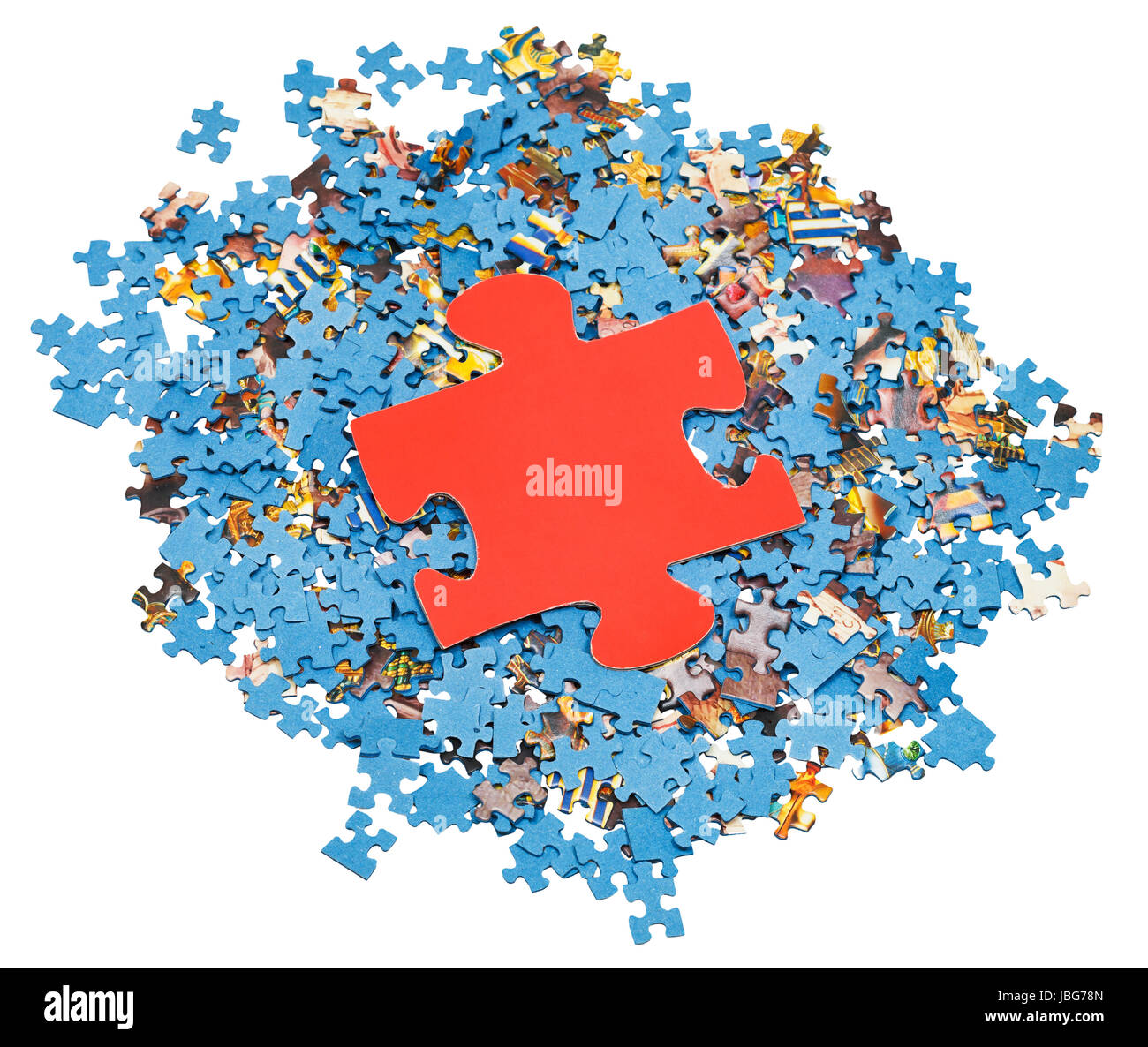 one big red piece on pile of disassembled little blue jigsaw puzzles ...