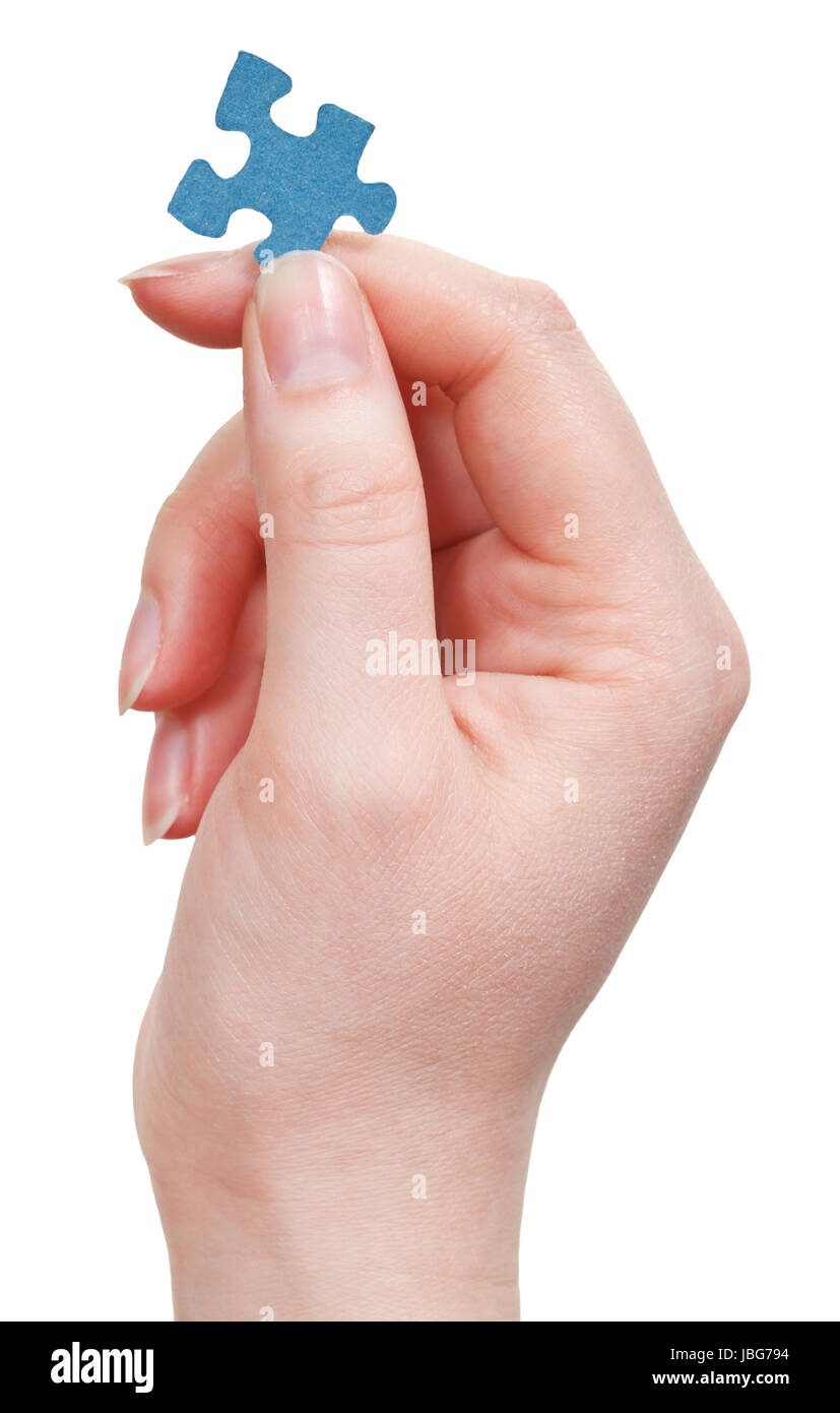 female arm holding little puzzle piece isolated on white background ...
