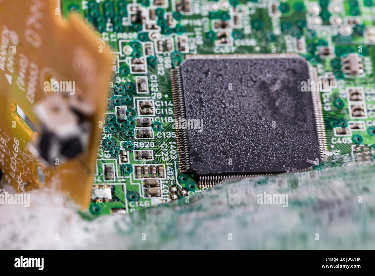 frozen electonics board for computer in ice Stock Photo - Alamy