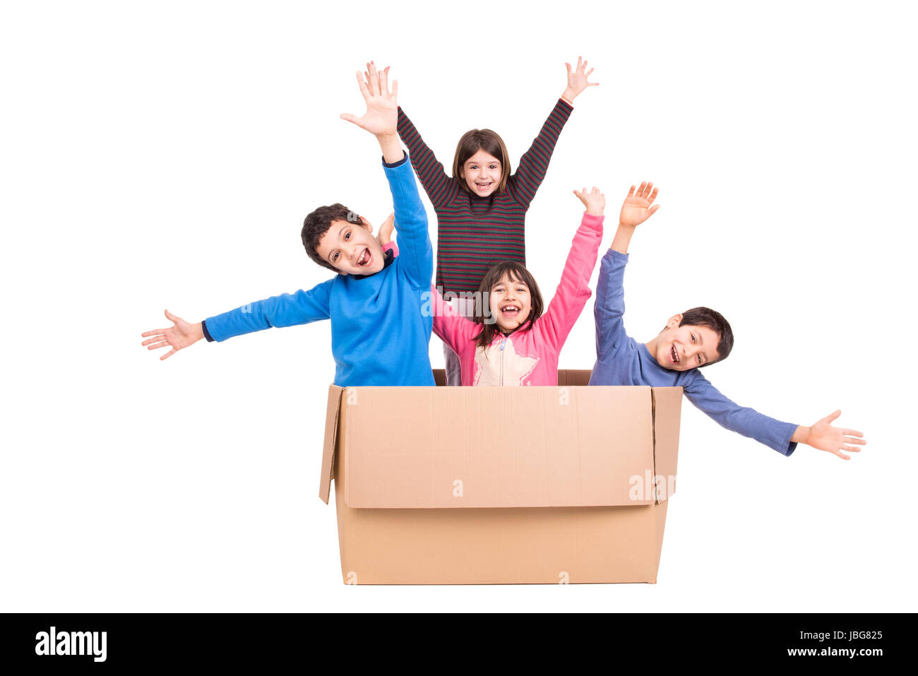 Happy kids inside a cardboard box isolated in white Stock Photo - Alamy