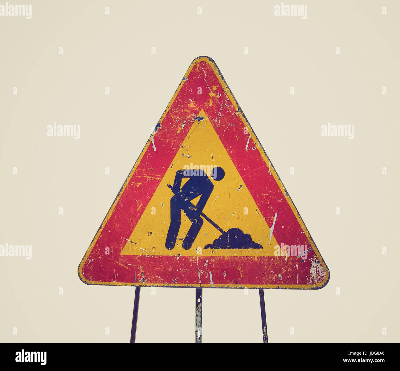Vintage retro looking Road work sign isolated Stock Photo - Alamy