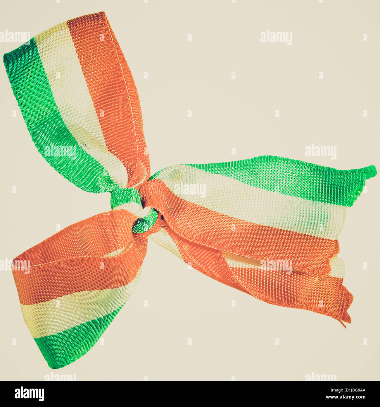 Vintage retro looking The national flag on a cockade isolated over ...