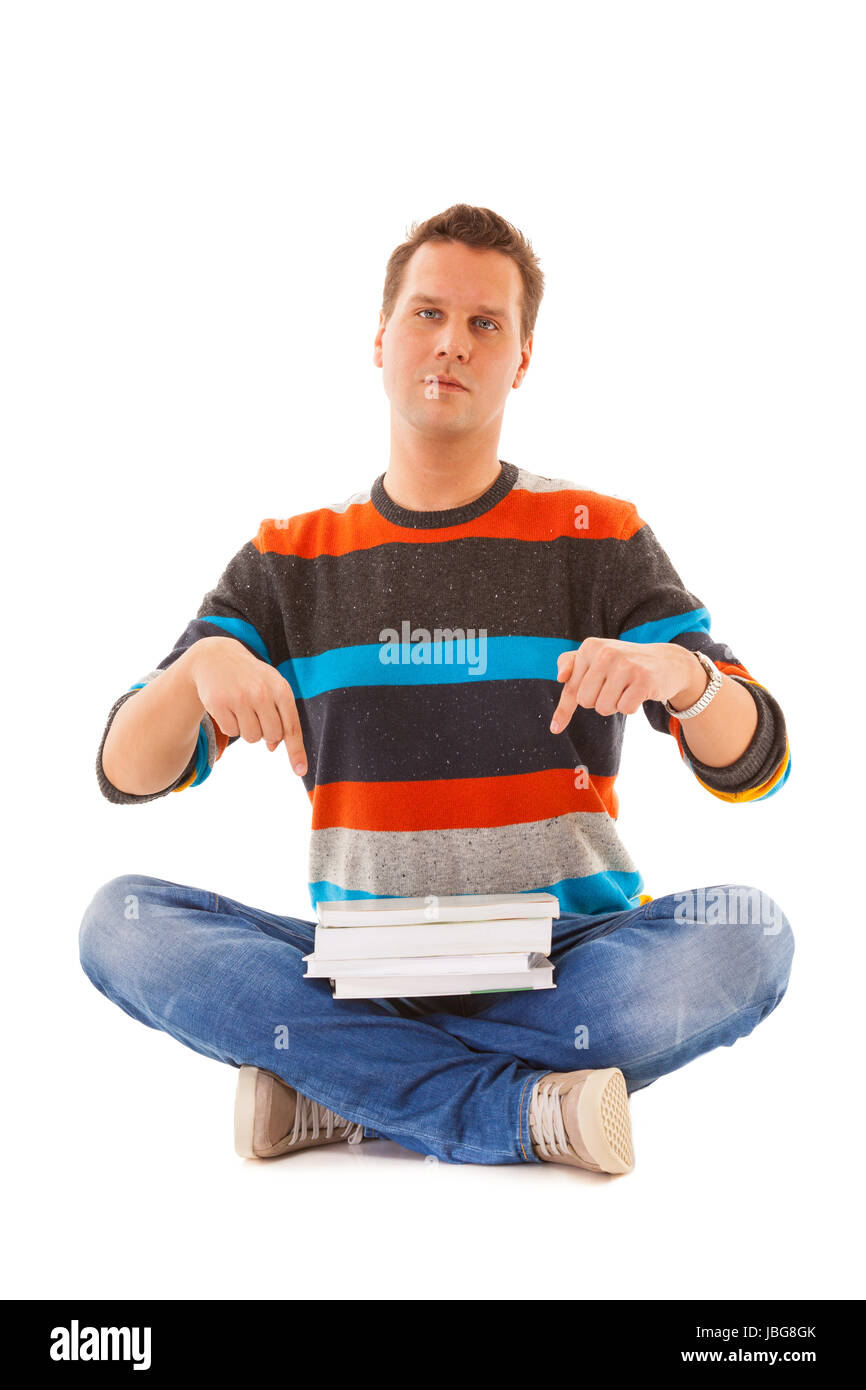 Portrait man male college student sitting and showing offering books ...