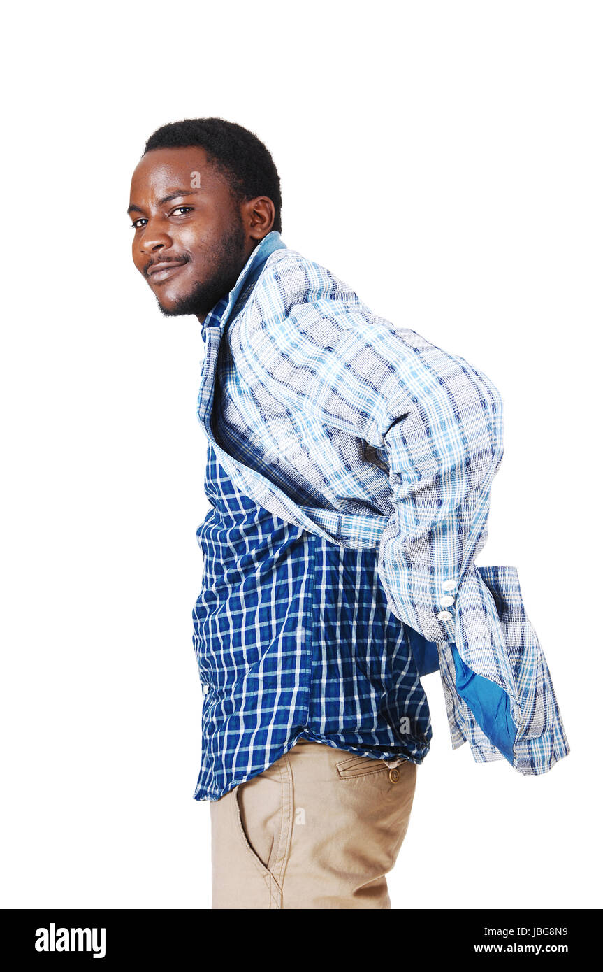 A young handsome black man in a blue shirt and a light blue jacket ...