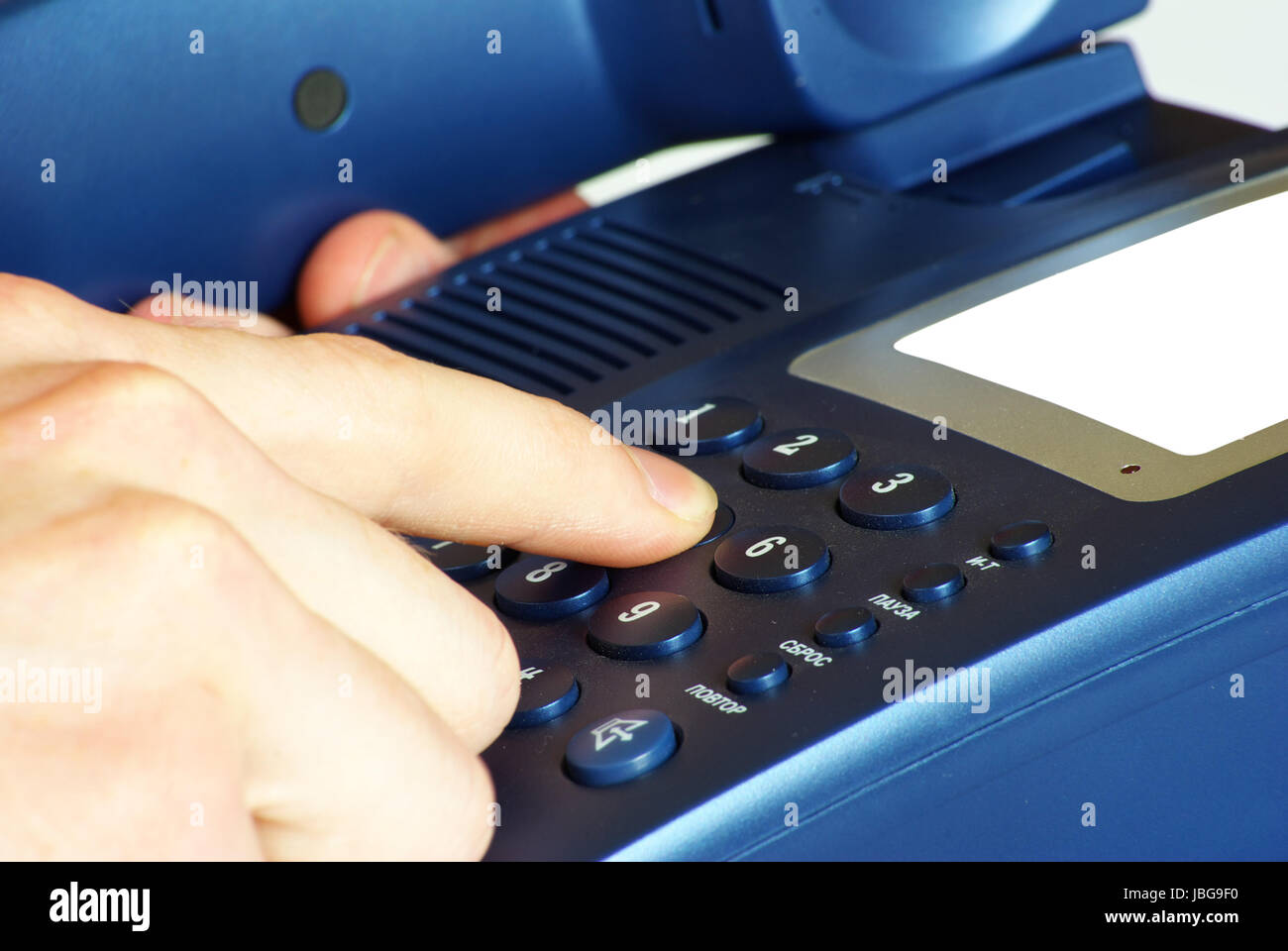 finger with blue keypad Stock Photo - Alamy