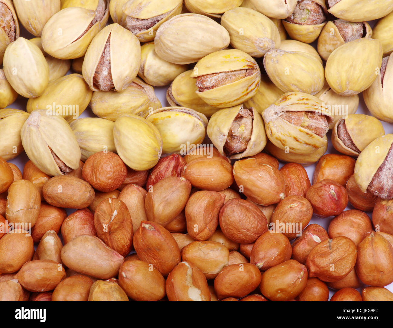 mixed nuts on a background Stock Photo - Alamy