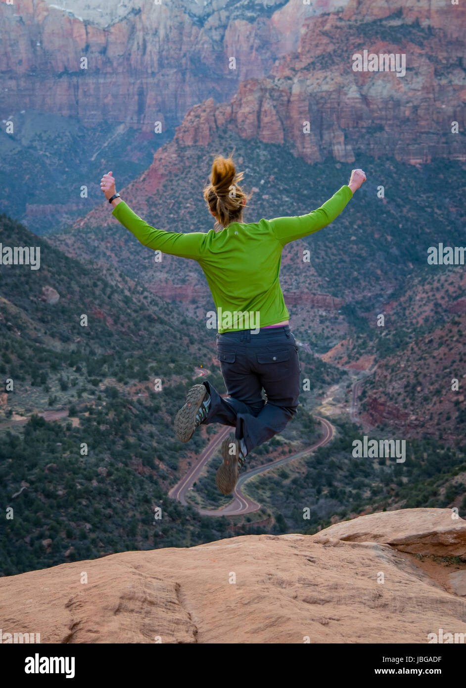 Jumping from Canyon Overlook in Zion National park Stock Photo - Alamy