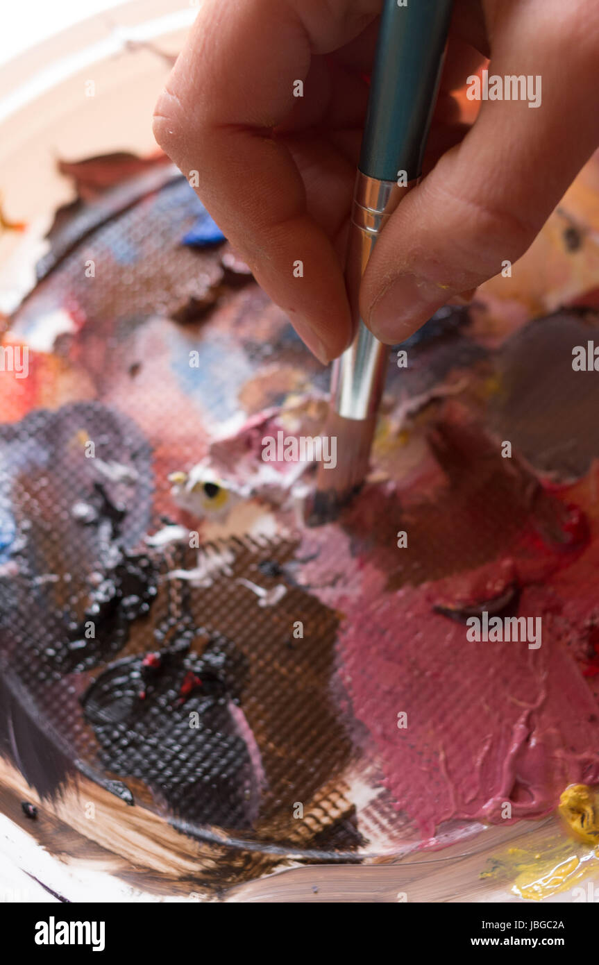 Color palette with oil paint and brush Stock Photo - Alamy