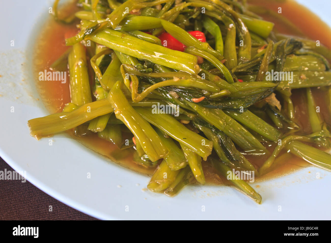Stir Fried Water Spinach, Thai food close up Stock Photo - Alamy