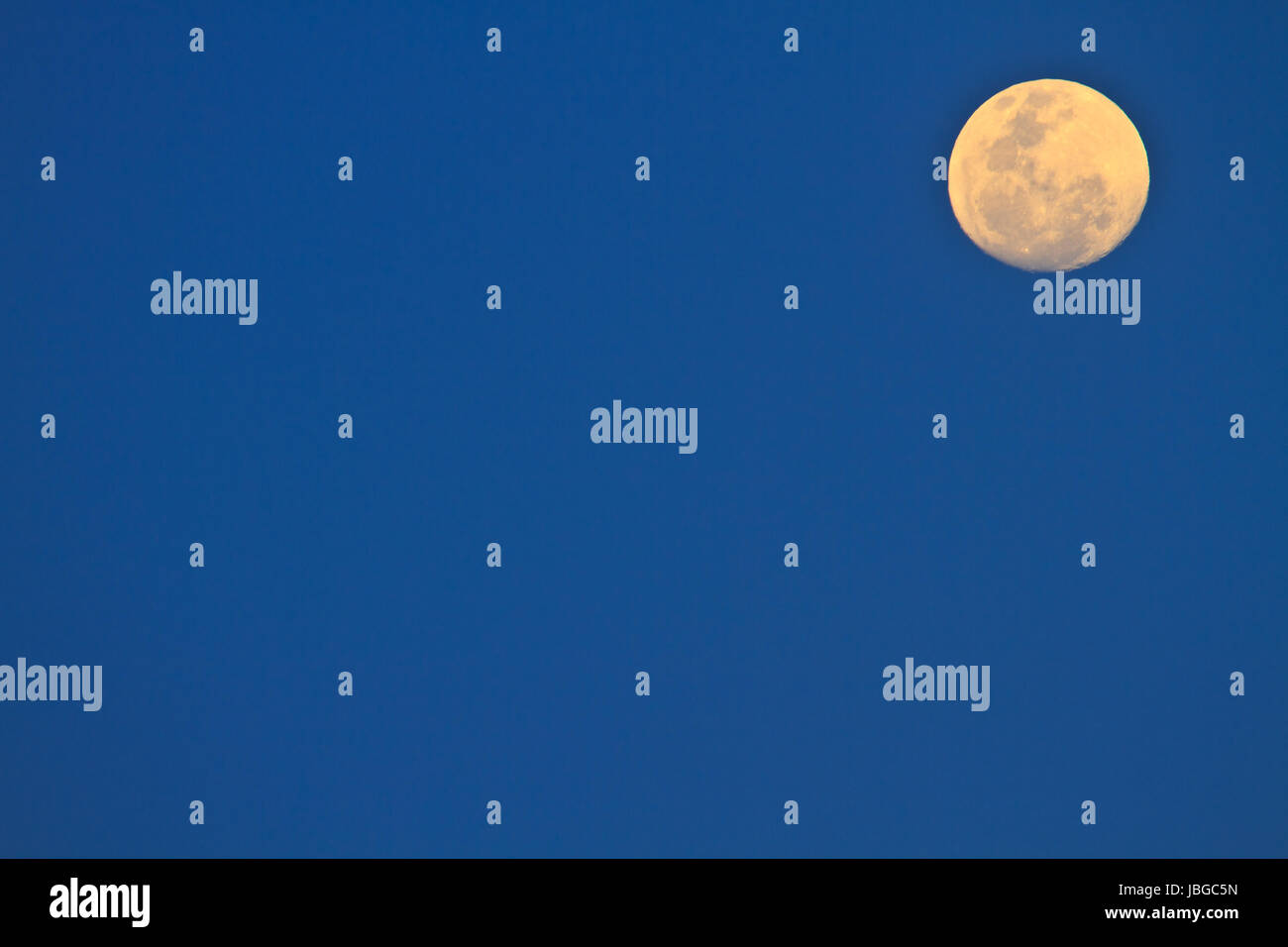 full moon in dark sky during the day Stock Photo - Alamy